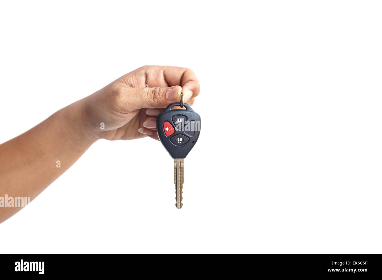 Hand holding car key isolated on white background Stock Photo - Alamy