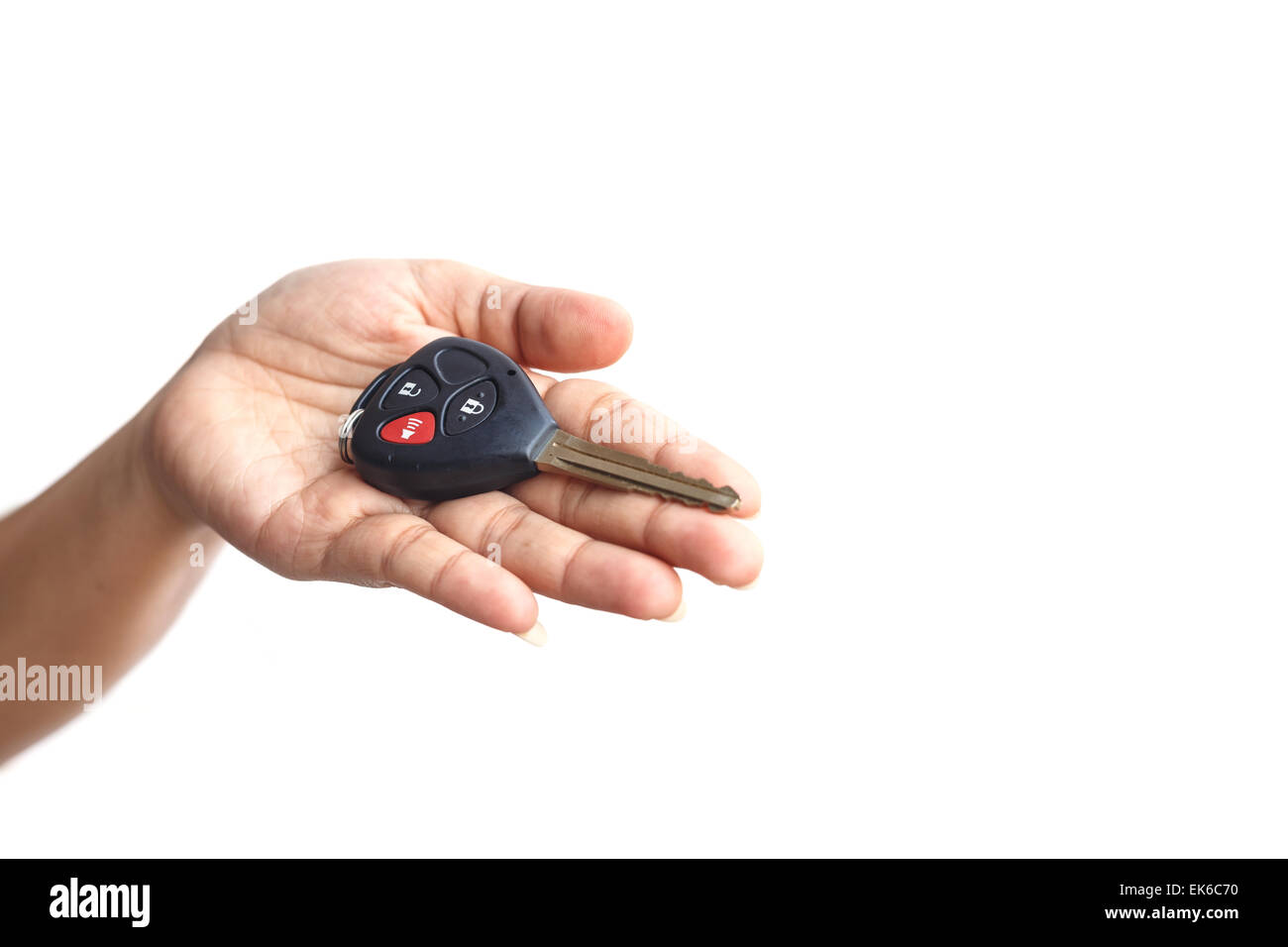 Hand holding car key isolated on white background Stock Photo - Alamy