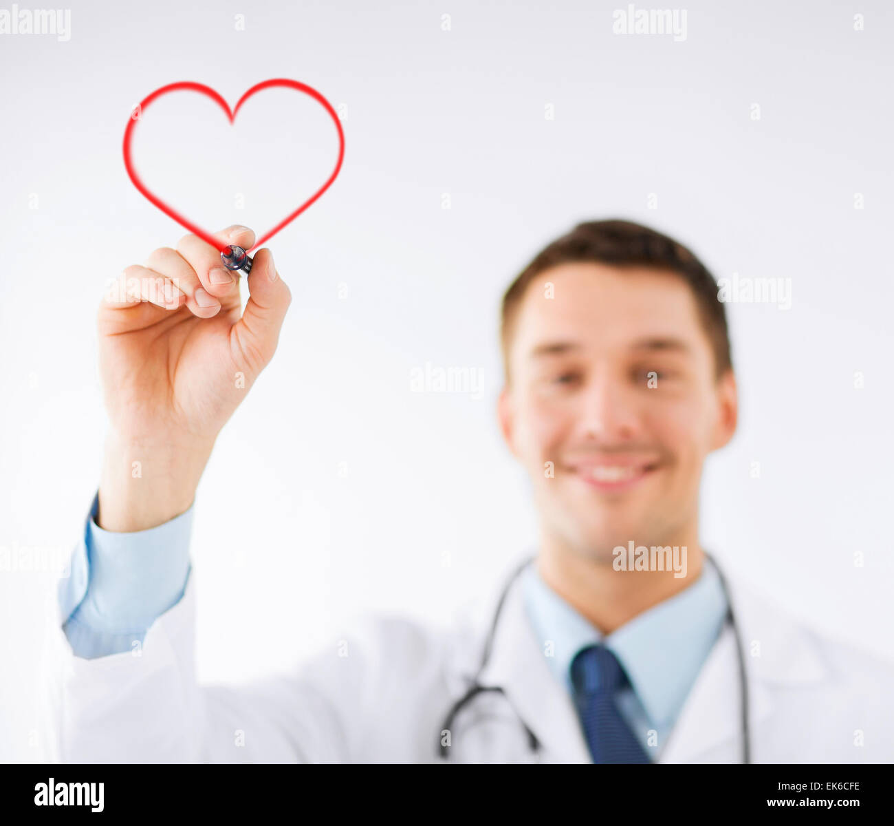 male doctor drawing heart in the air Stock Photo - Alamy