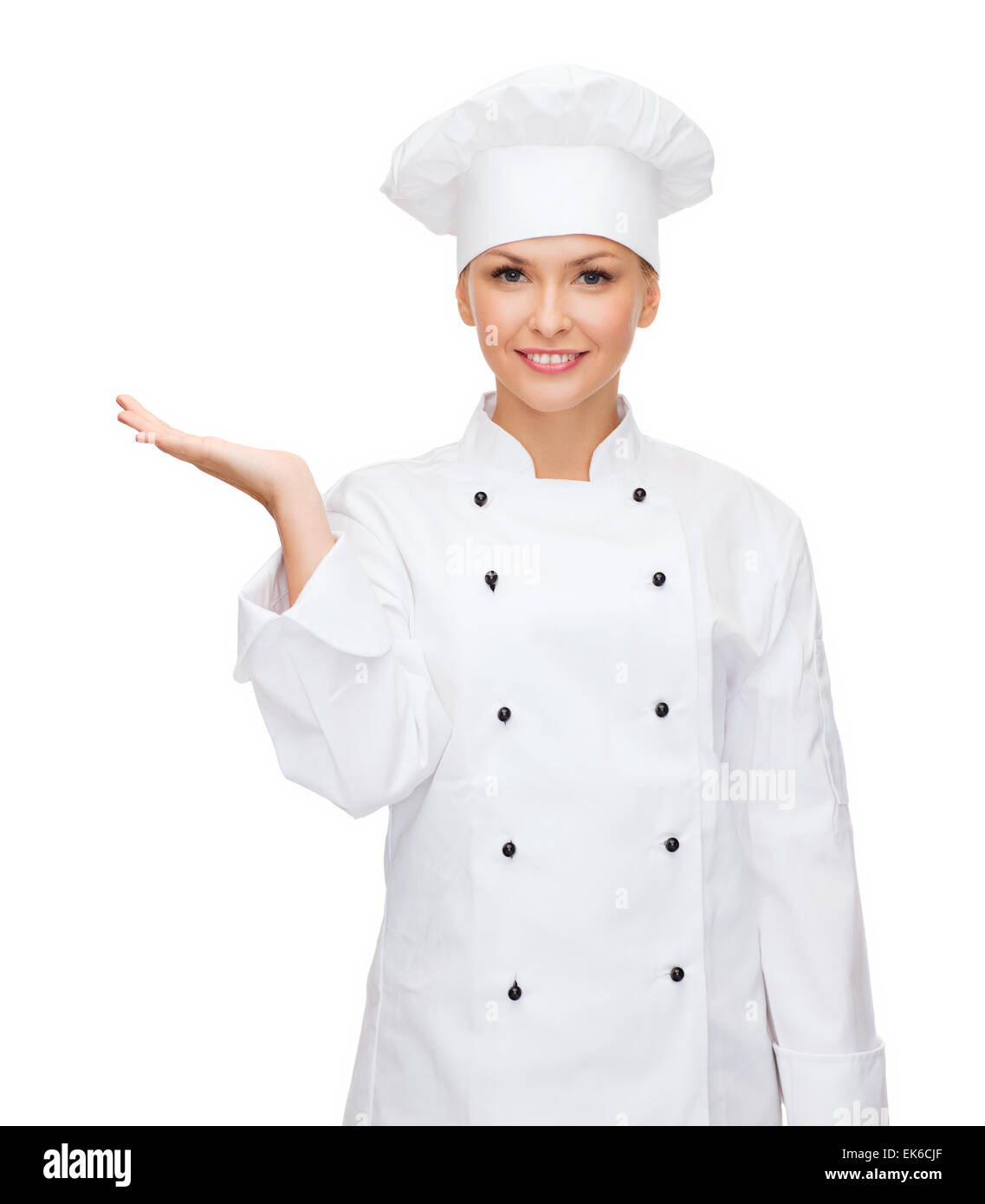 smiling female chef holding something on hand Stock Photo - Alamy