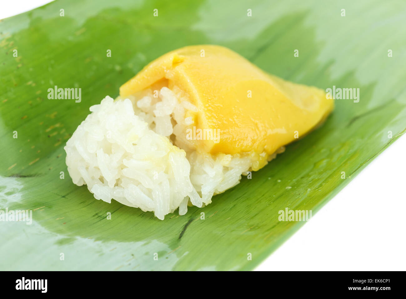Sticky rice with steamed custard, wrapped in banana leaves isolated on ...