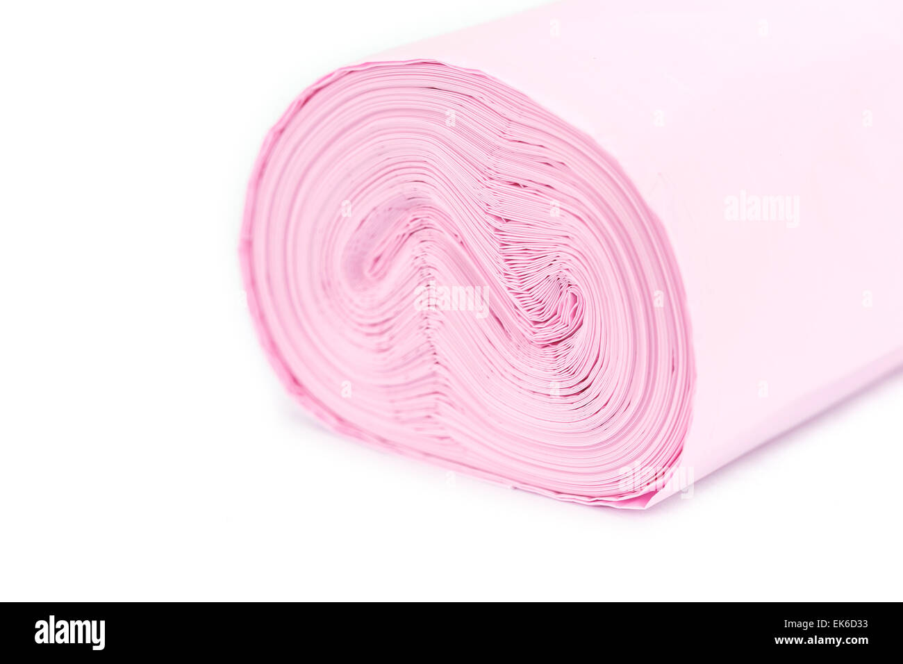 Roll of pink garbage bag isolated on white background Stock Photo - Alamy