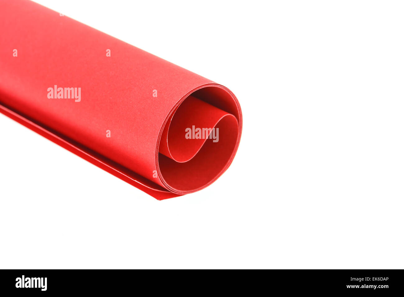Red paper roll isolated on white background Stock Photo - Alamy