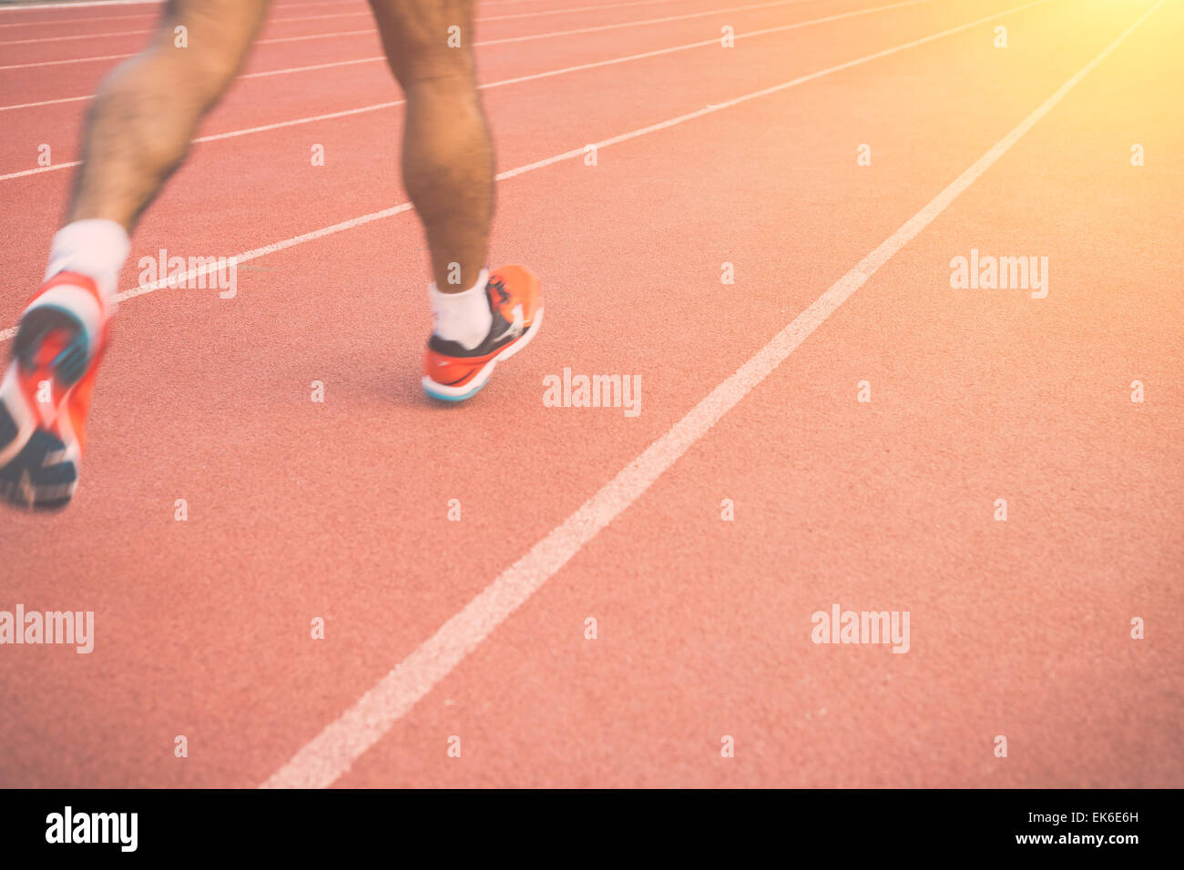 Close up Running track with blur of runner feet in stadium Stock Photo ...