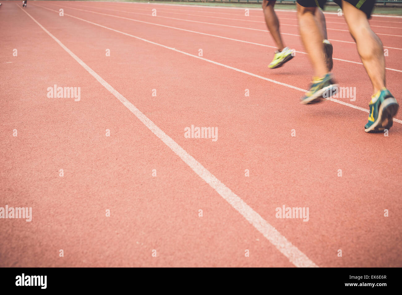 Close up Running track with blur of runner feet in stadium Stock Photo ...