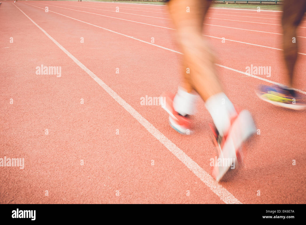 Close up Running track with blur of runner feet in stadium Stock Photo ...