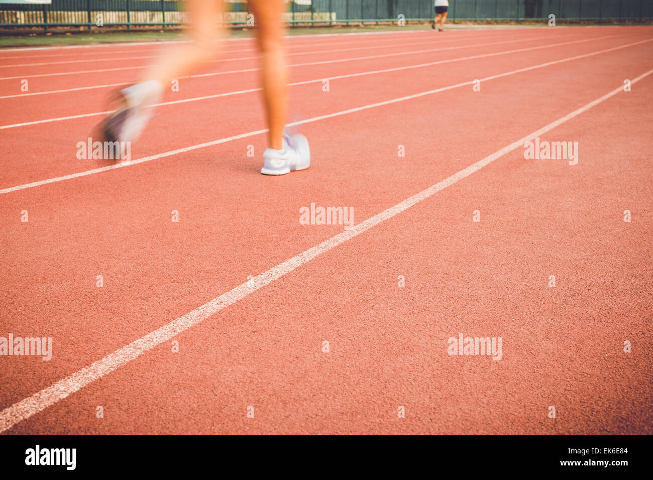Close up Running track with blur of runner feet in stadium Stock Photo ...