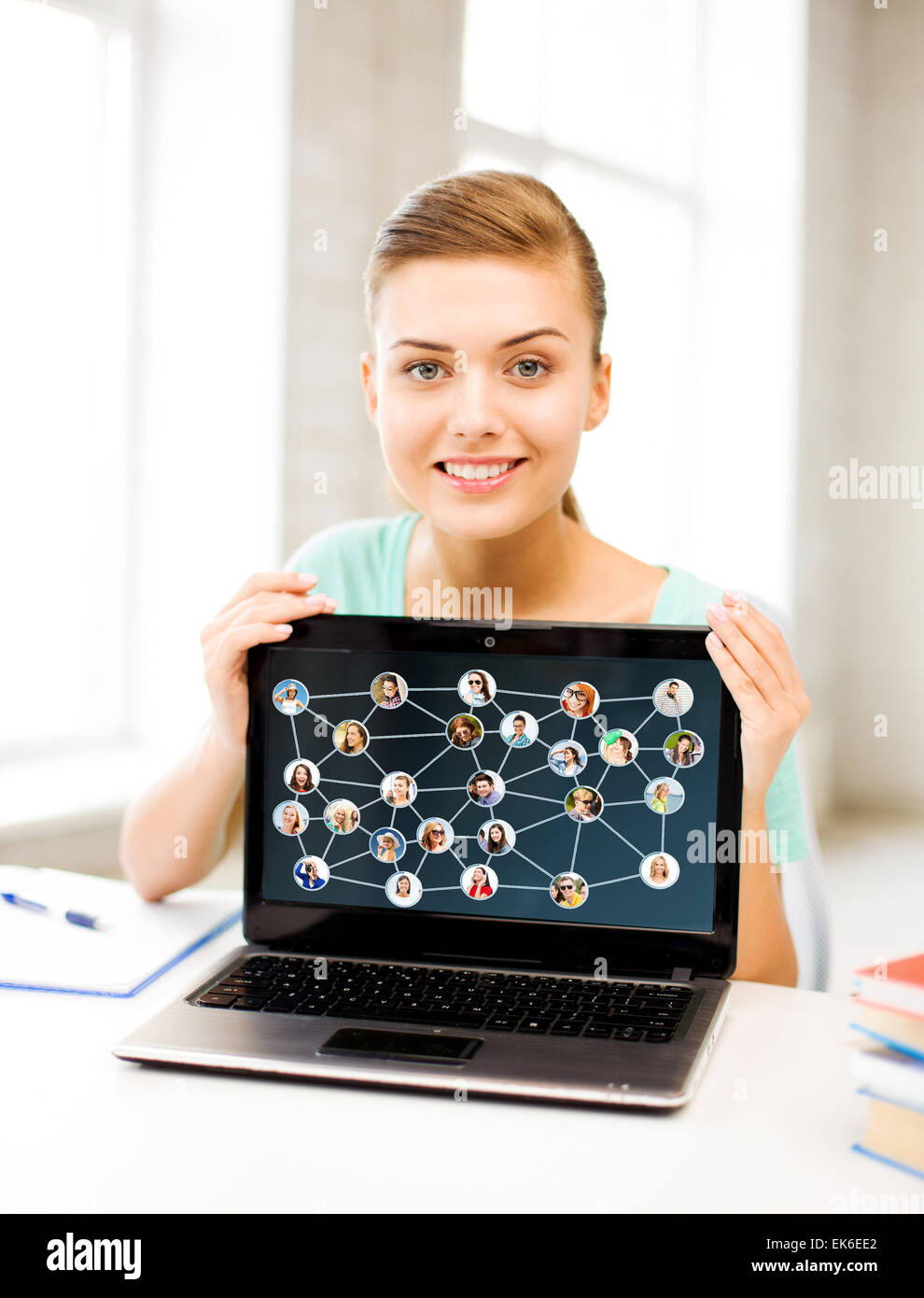 smiling student girl with laptop at school Stock Photo - Alamy