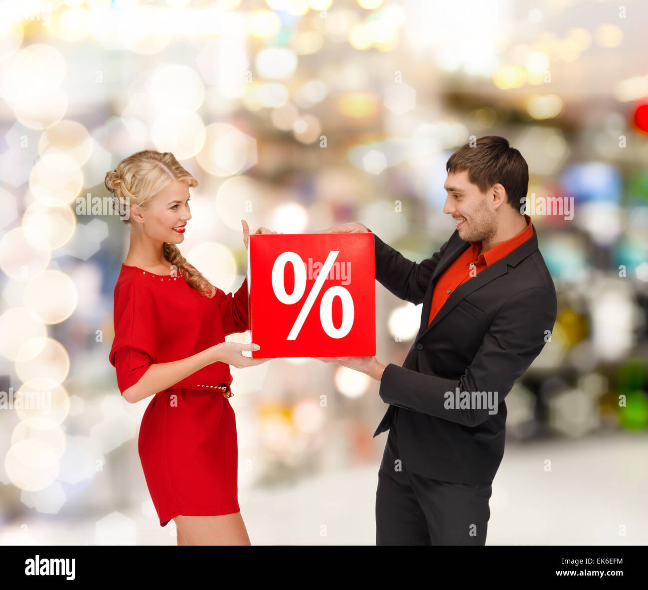 smiling woman and man with red percent sale sign Stock Photo - Alamy