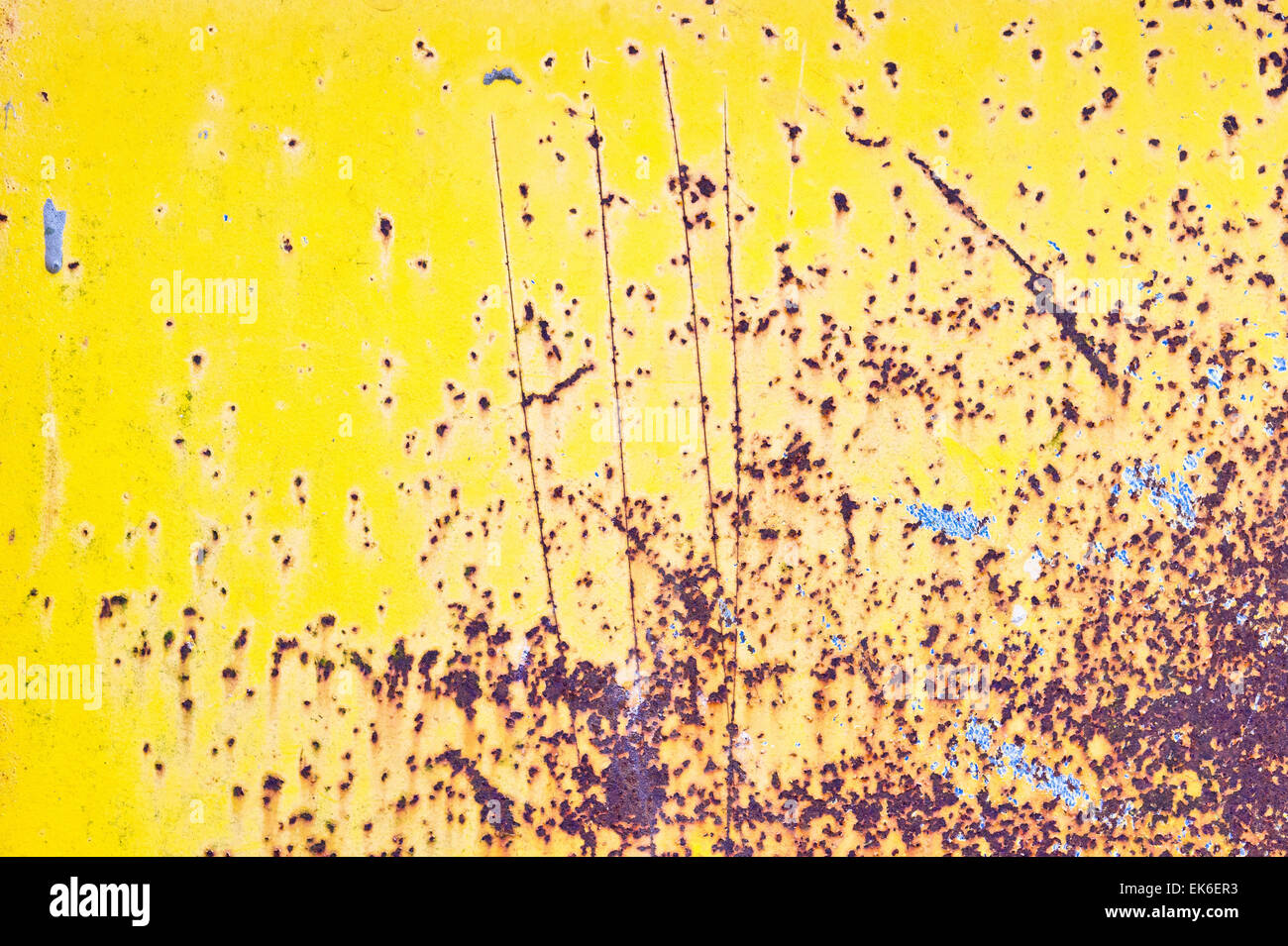 Yellow metal sheet with rust patches, as a background Stock Photo - Alamy