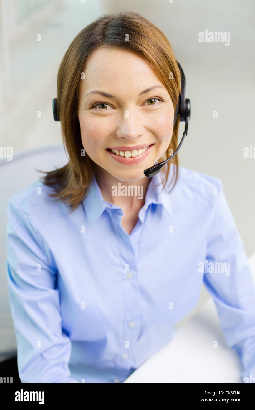 female helpline operator with headphones Stock Photo - Alamy