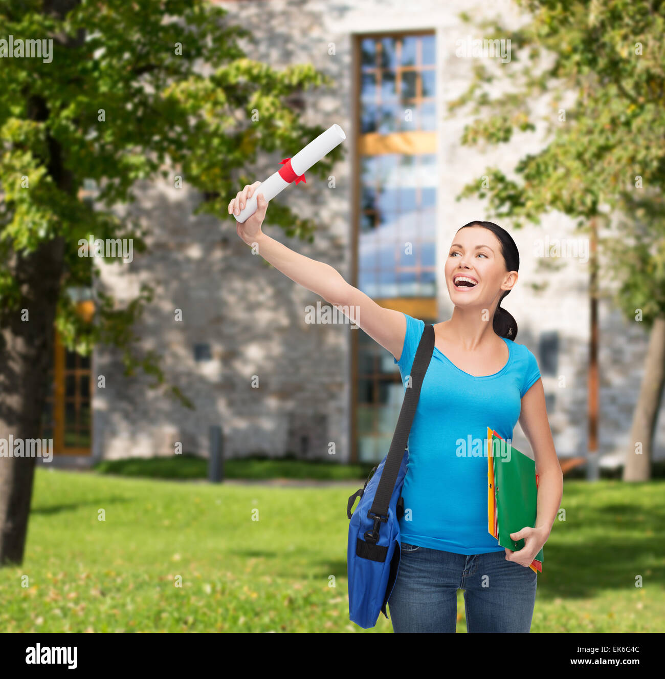 smiling student with bag and folders Stock Photo - Alamy