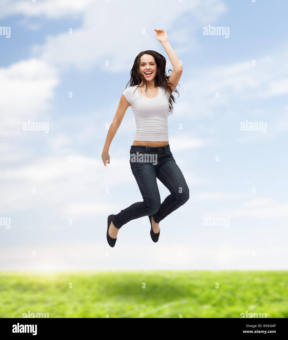 teenage girl in white blank t-shirt jumping Stock Photo - Alamy
