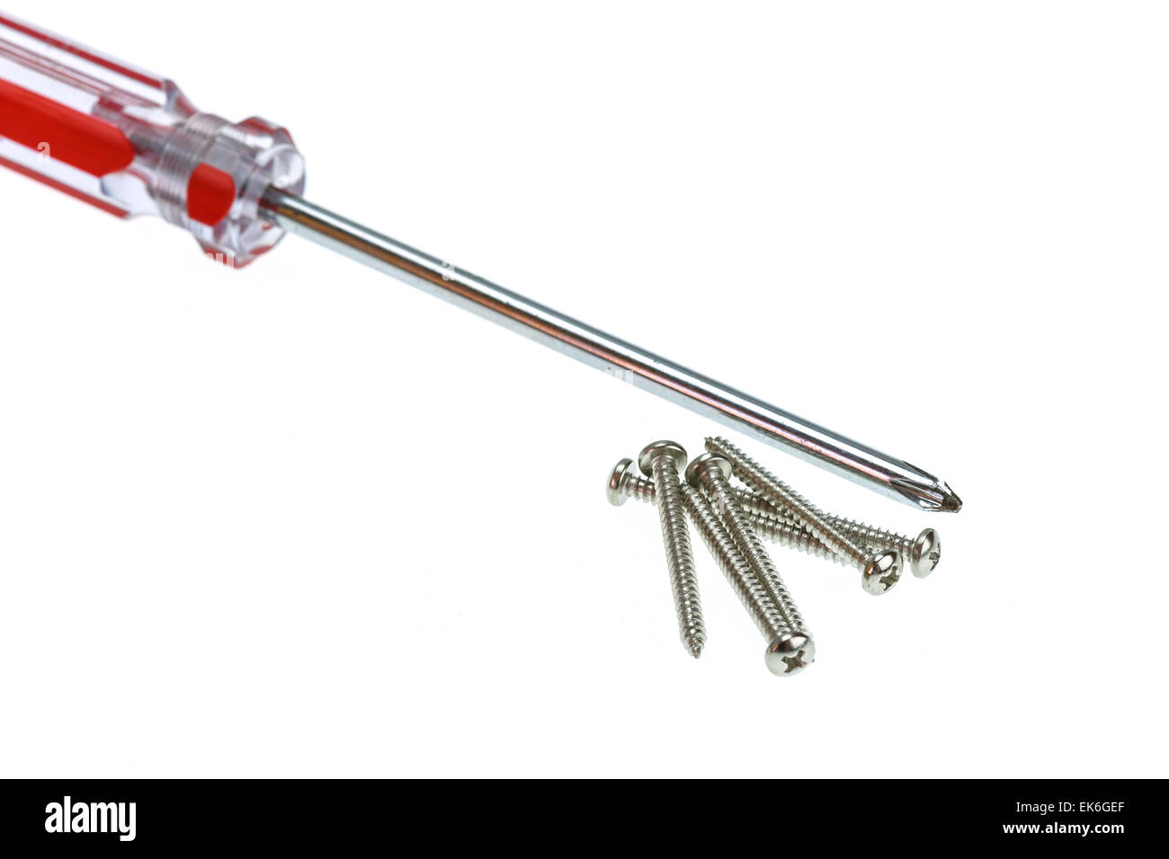Screw and screwdriver isolated on white background Stock Photo - Alamy