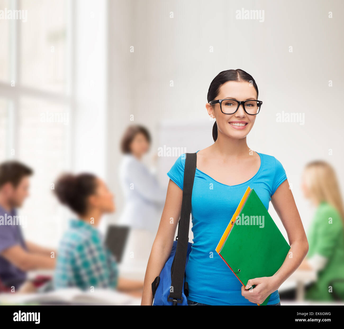 smiling student with bag and folders Stock Photo - Alamy