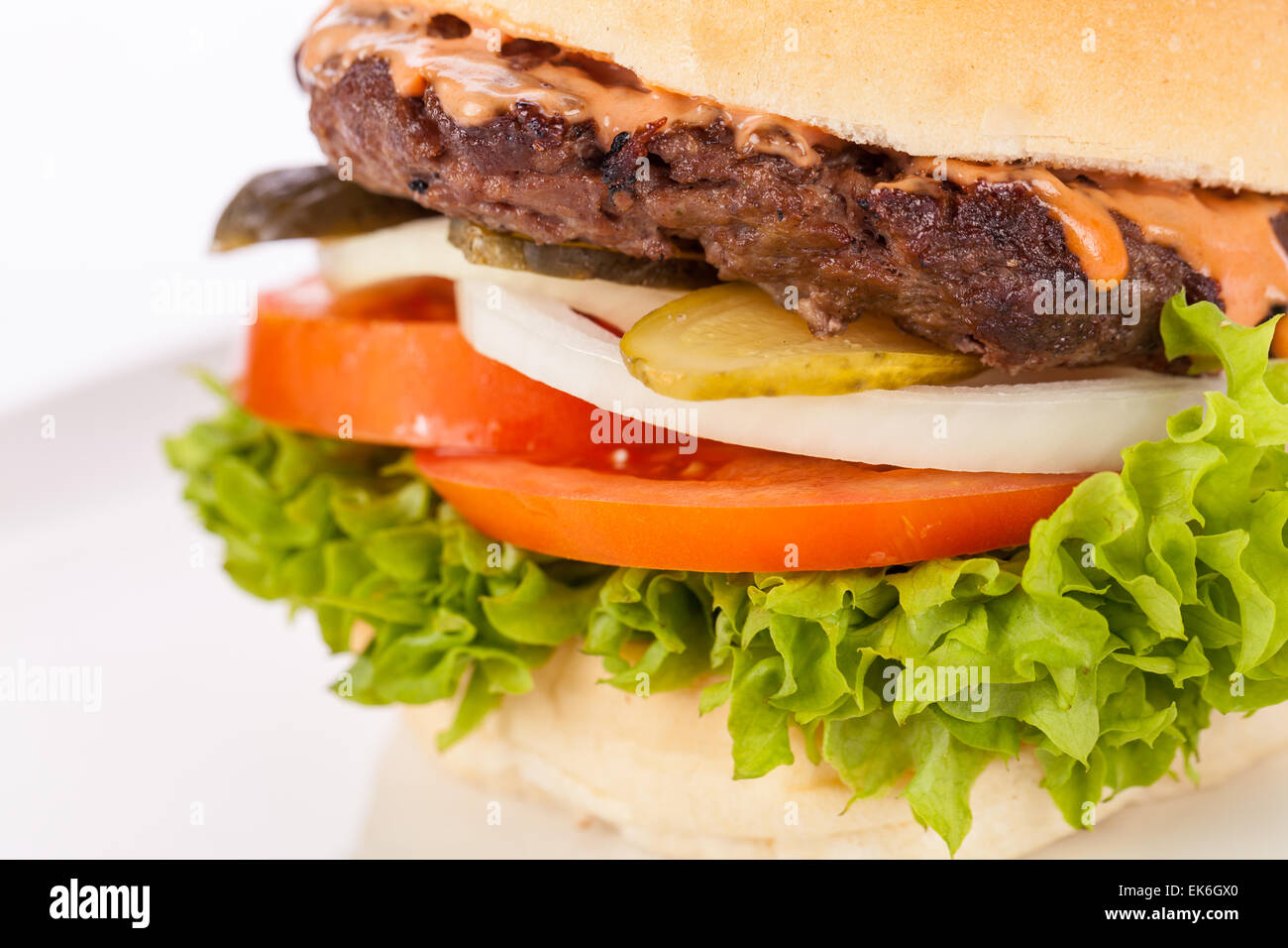 Tasty traditional cheeseburger with a ground beef patty topped with ...