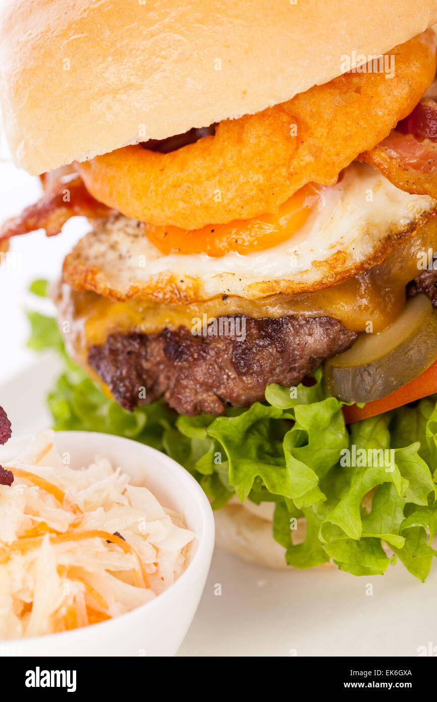 Tasty traditional cheeseburger with a ground beef patty topped with ...