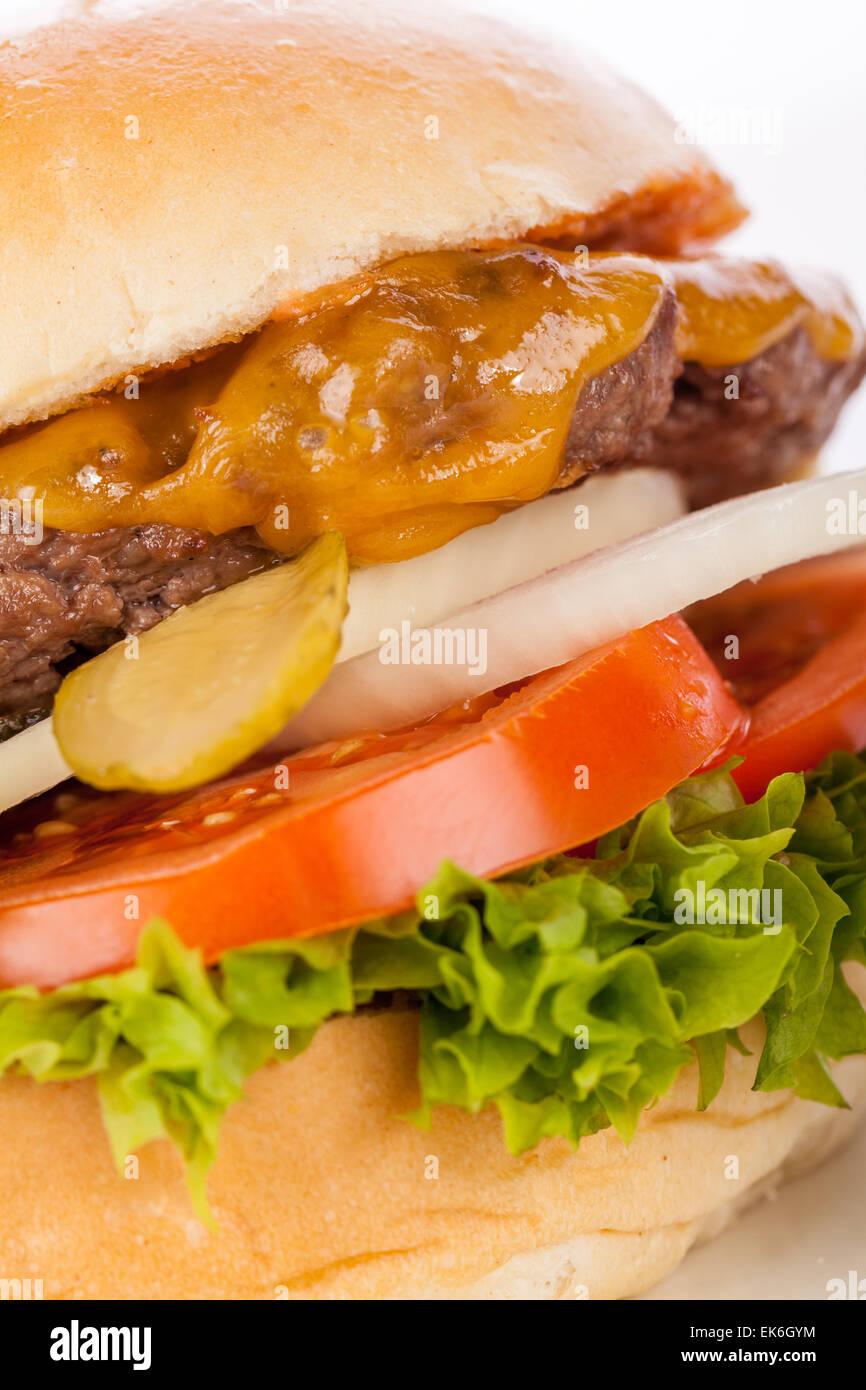 Tasty traditional cheeseburger with a ground beef patty topped with ...