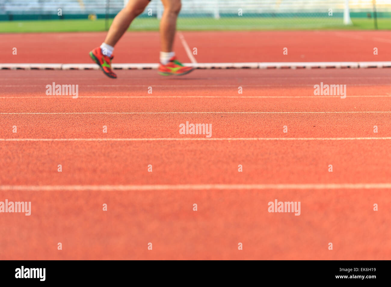 Close up Running track with blur of runner feet in stadium Stock Photo ...