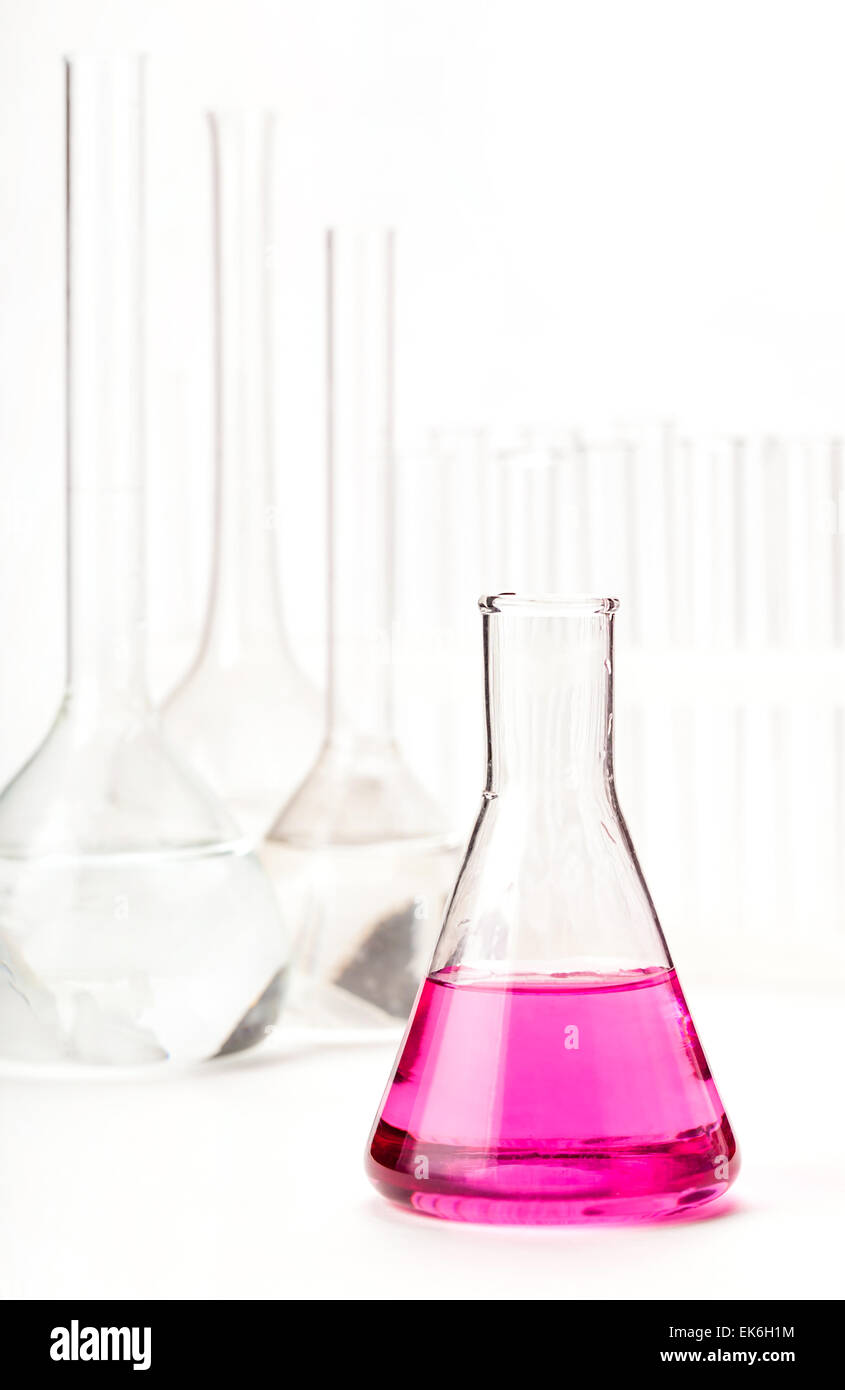 variety of glass flasks with reagents on a light background Stock Photo ...