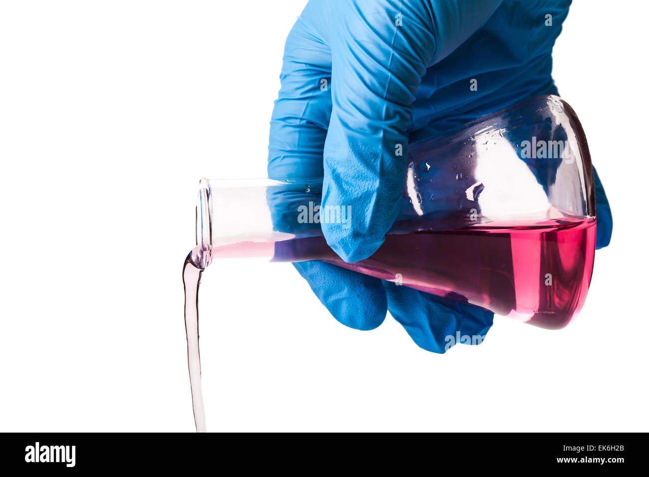assistant reagent pouring on white isolated background Stock Photo - Alamy