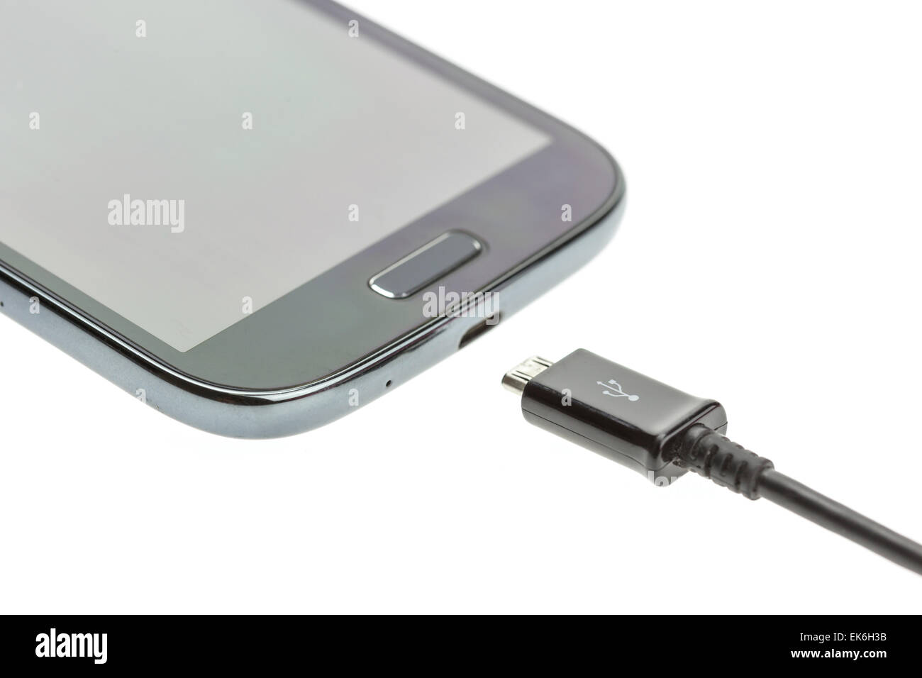 Macro Smartphone with charger cable isolated on white background Stock ...