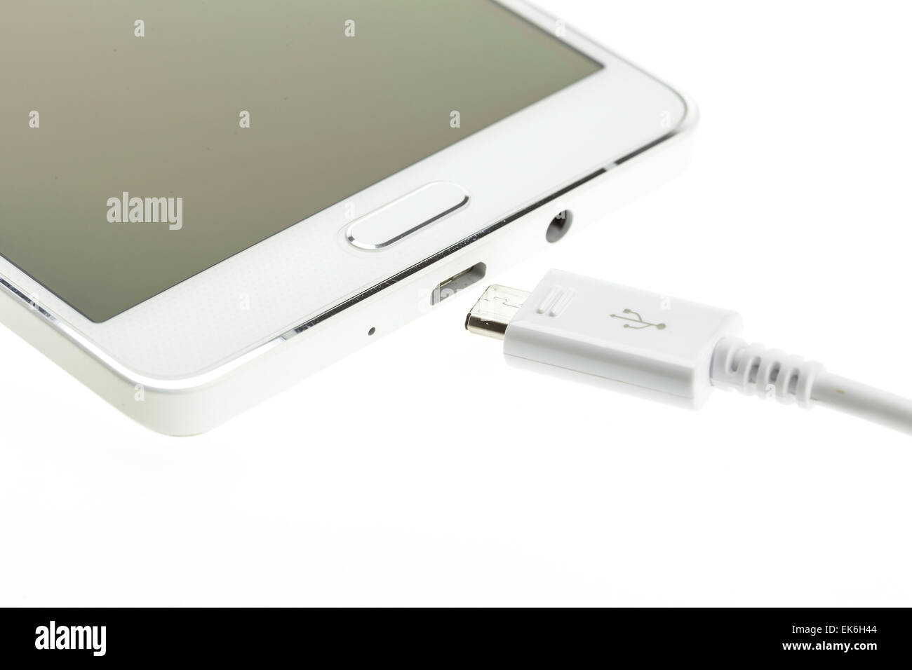 Macro Smartphone with charger cable isolated on white background Stock ...