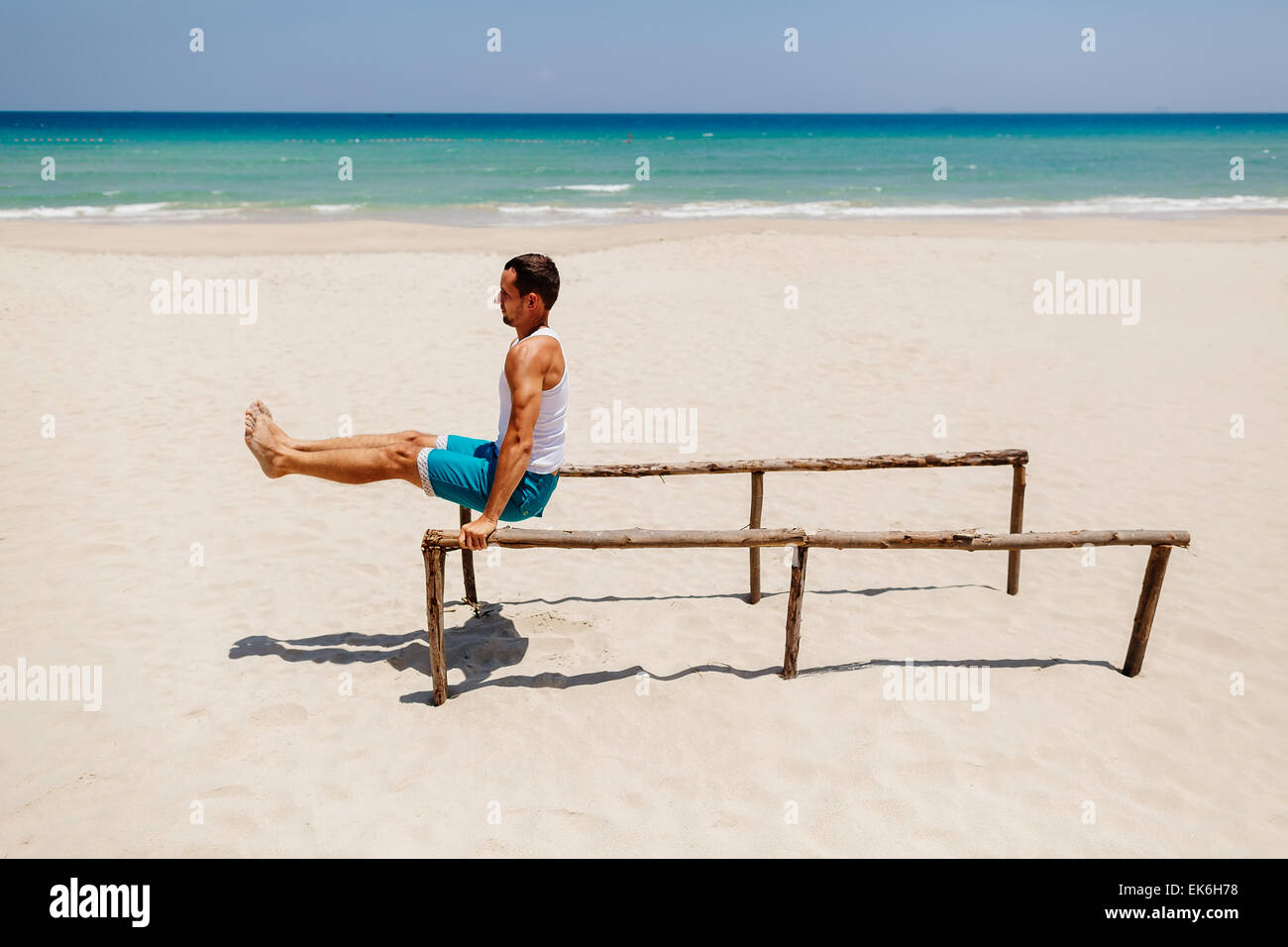 fitness handsome man work out on the beach with sea view Stock Photo ...