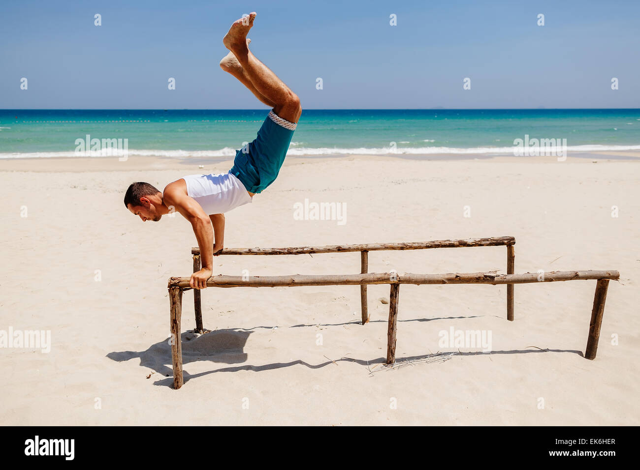 fitness handsome man work out on the beach with sea view Stock Photo ...