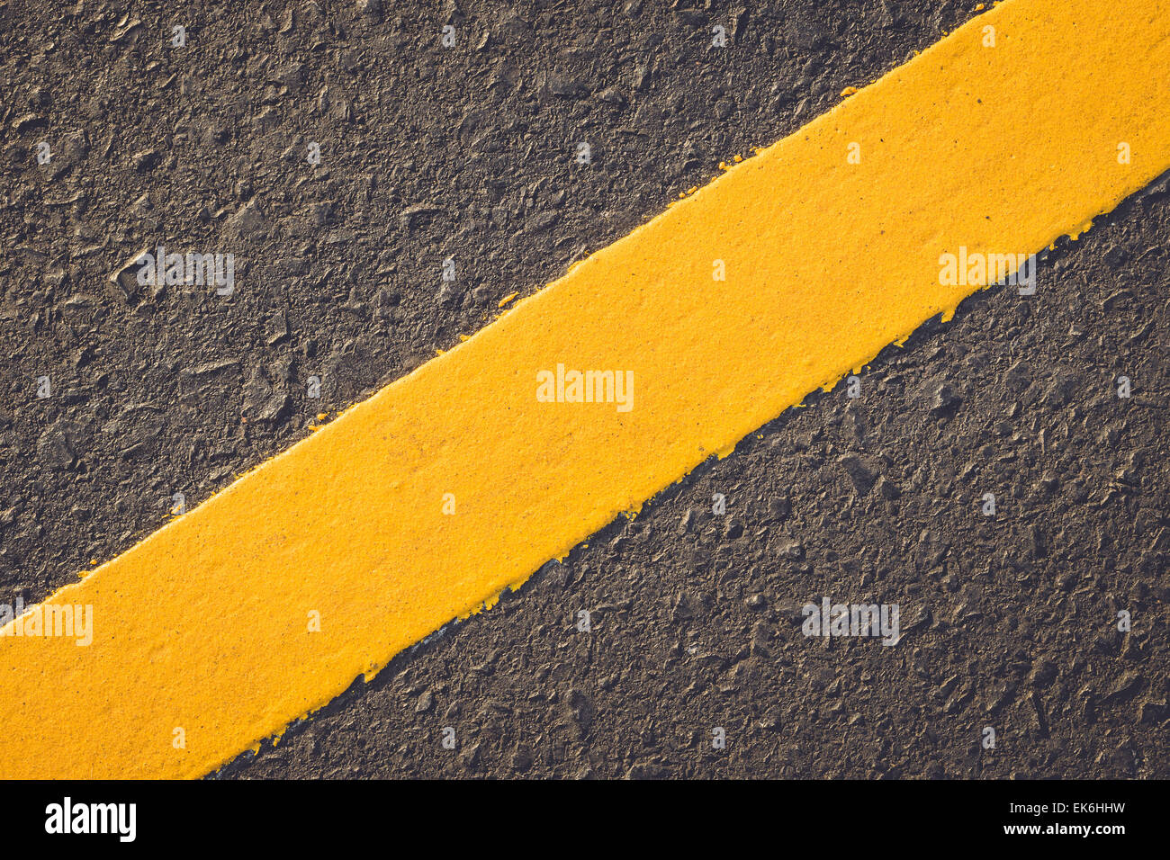 Asphalt road texture with yellow stripe Stock Photo - Alamy