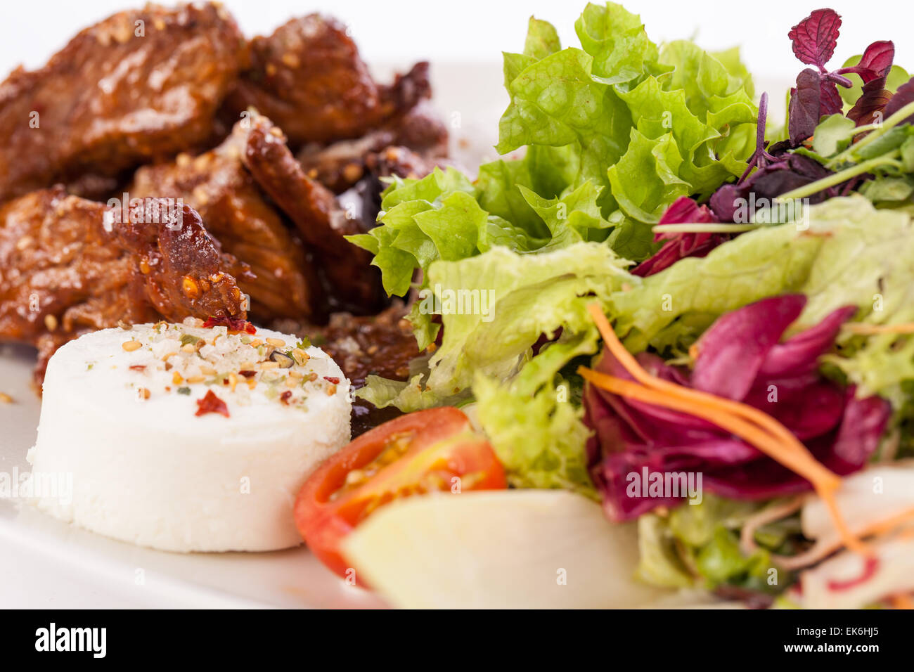 grilled beef stripes fresh mixed salad and warm goat cheese Stock Photo ...