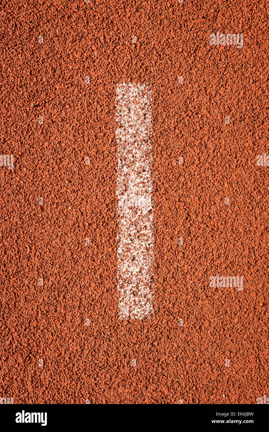 Running track with white stripe for athletics Stock Photo - Alamy