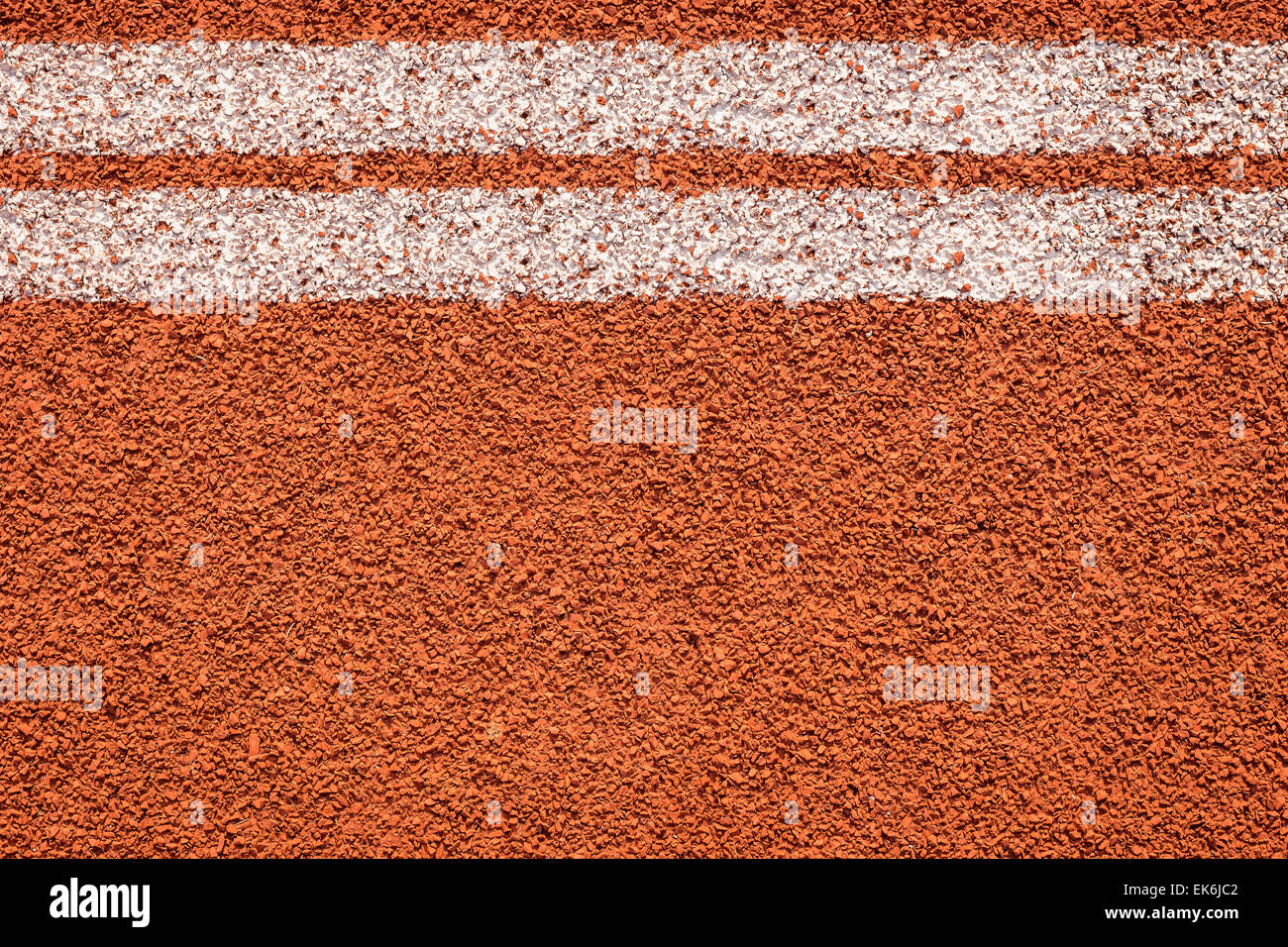 Running track with white stripe for athletics Stock Photo - Alamy
