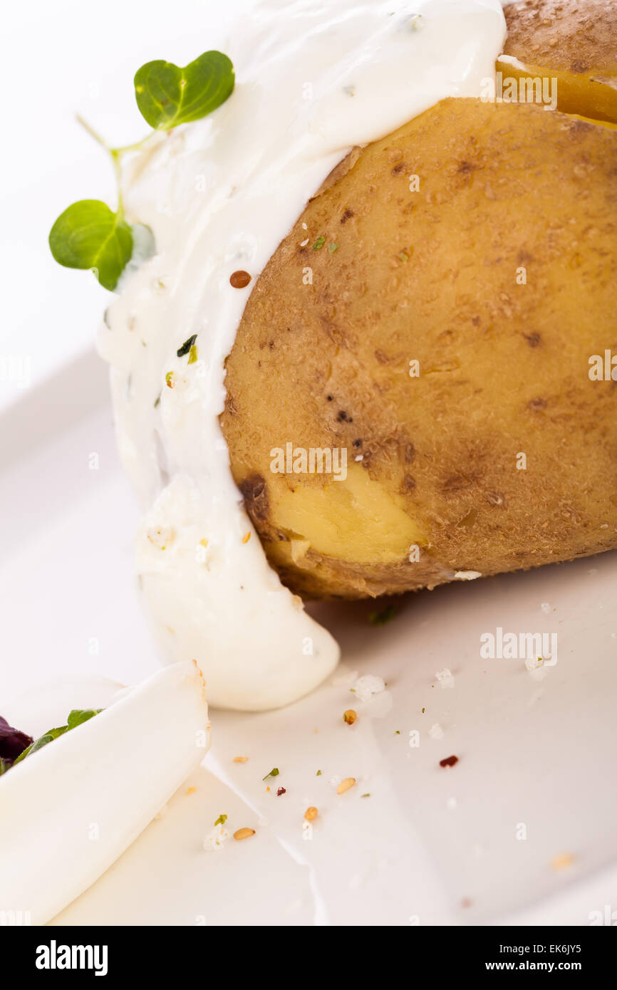Overhead view of a healthy oven baked jacket potato with sour cream ...
