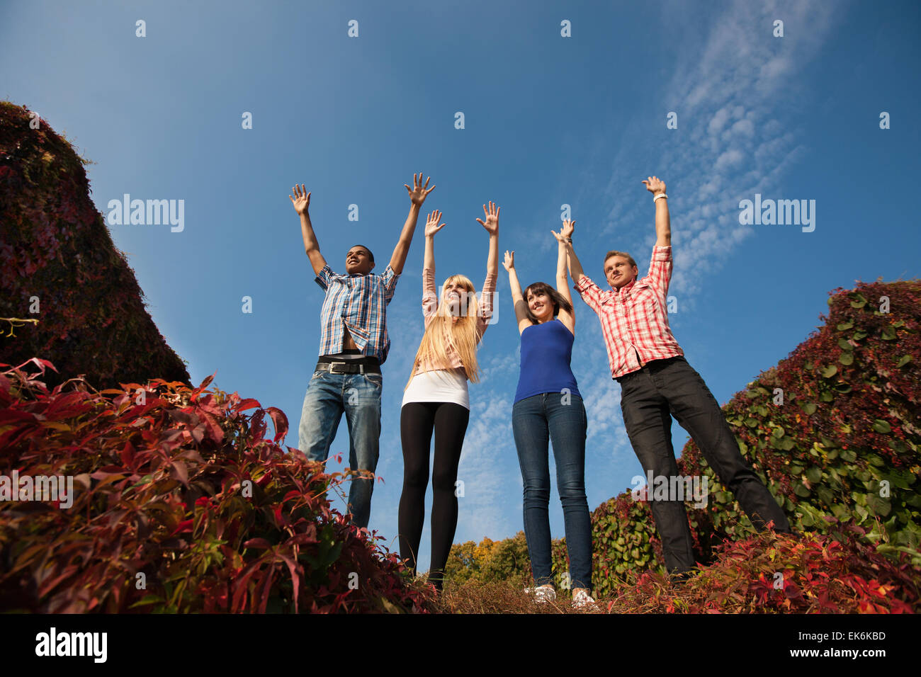 People rise up hands acrosss sky Stock Photo - Alamy