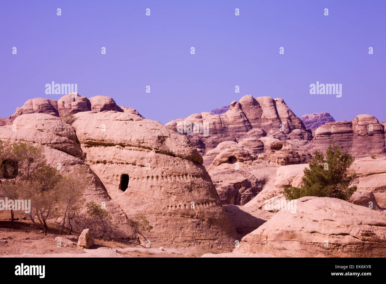 Ancient caves flank the entrance to the famed 3rd century Nabataean ...