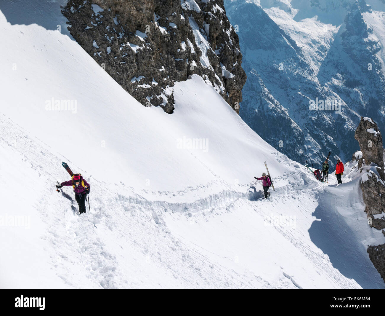 Backcountry skiers traversing steep slope, northeast of Cortina ...