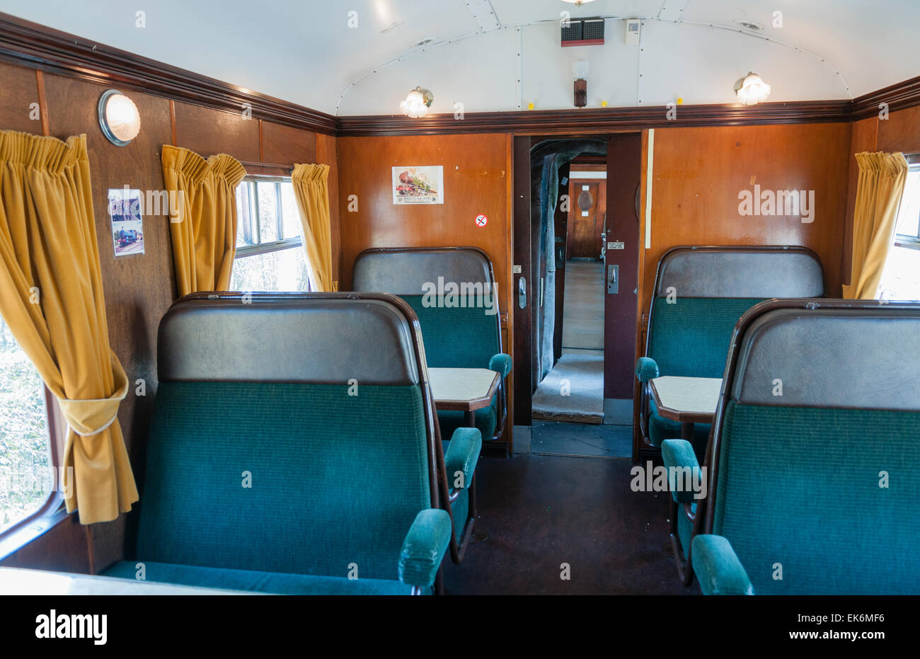 Inside a First Class carriage of an old fashioned train with curtains ...