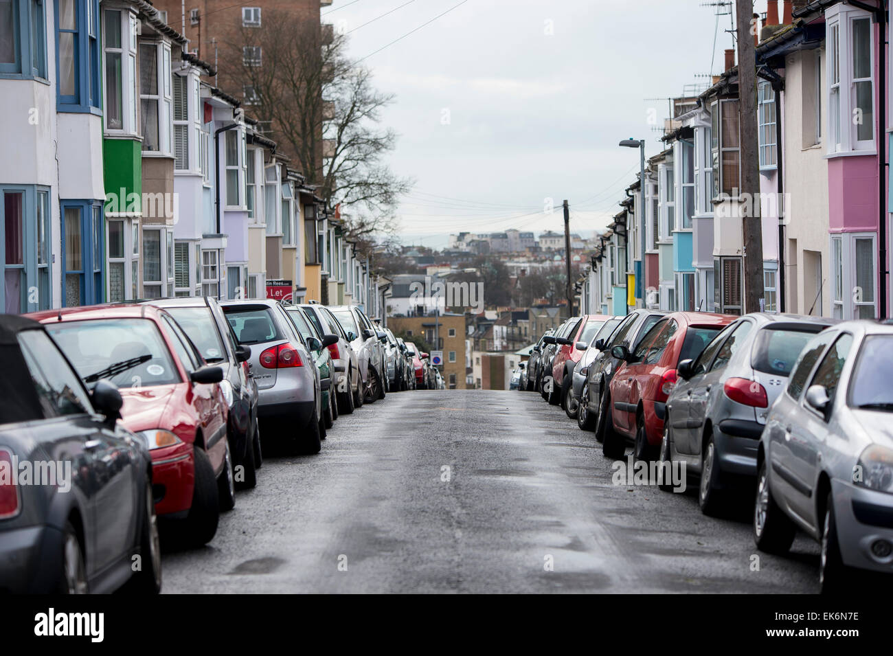 Parked cars lined up in a narrow street in Brighton, Sussex, UK Stock ...