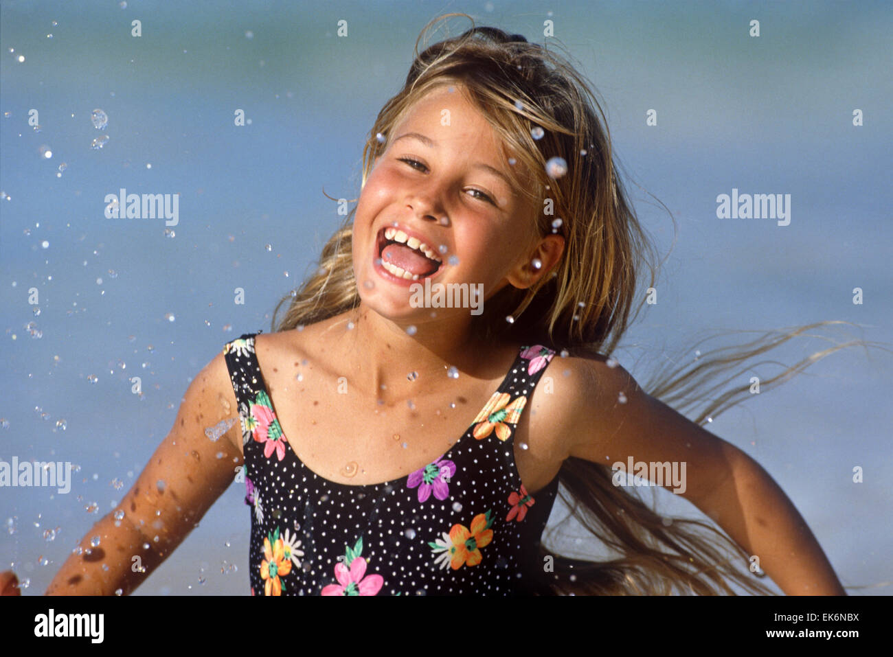 girl running in water Stock Photo - Alamy