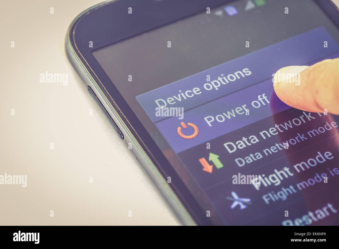 Close up finger press power off button on smartphone Stock Photo - Alamy