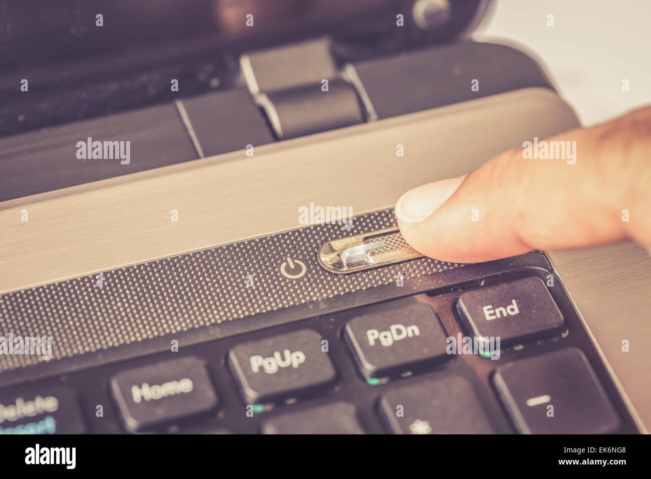 Close up finger press power off button on laptop Stock Photo - Alamy