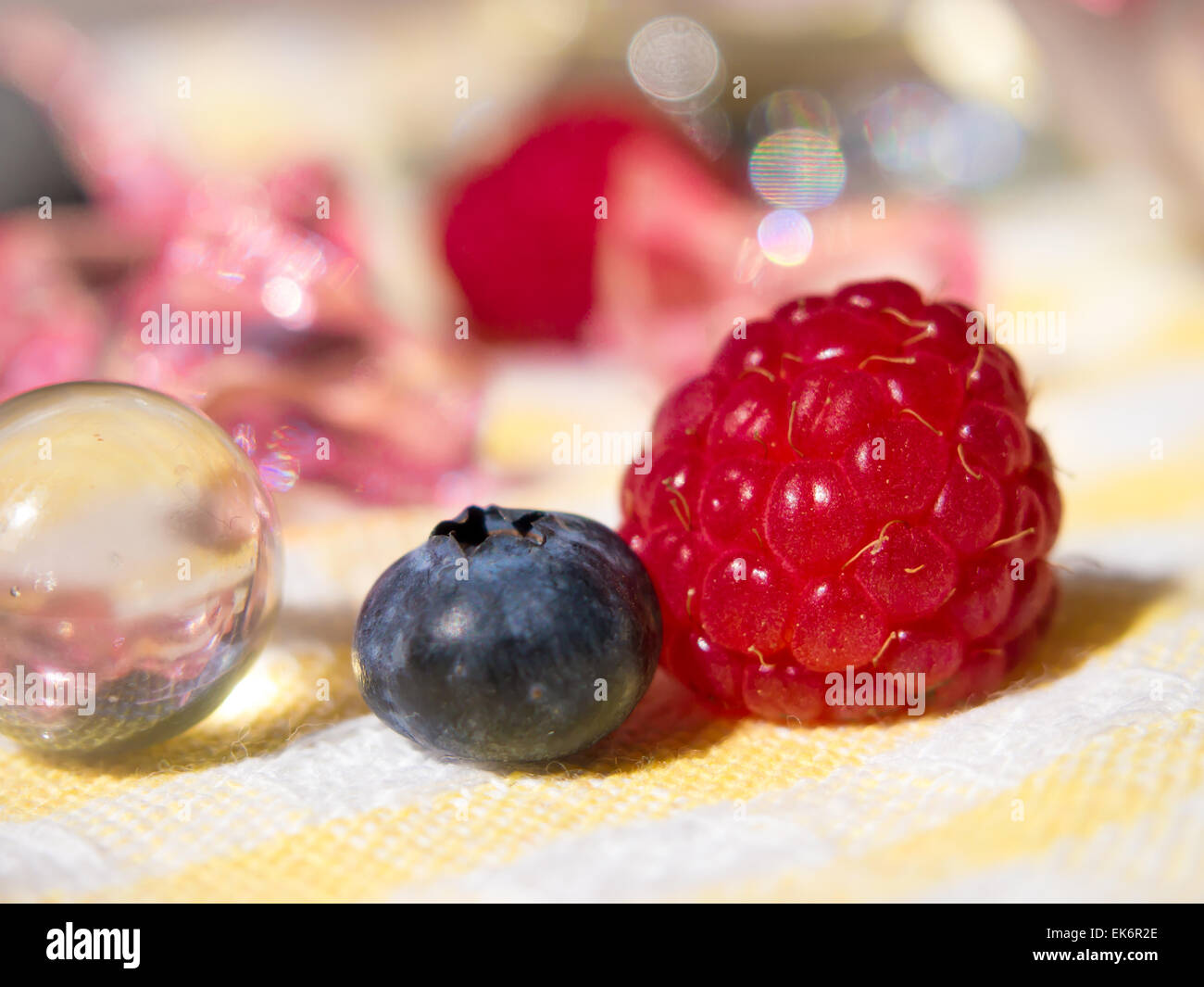 cute blueberry and raspberry are sitting together Stock Photo - Alamy
