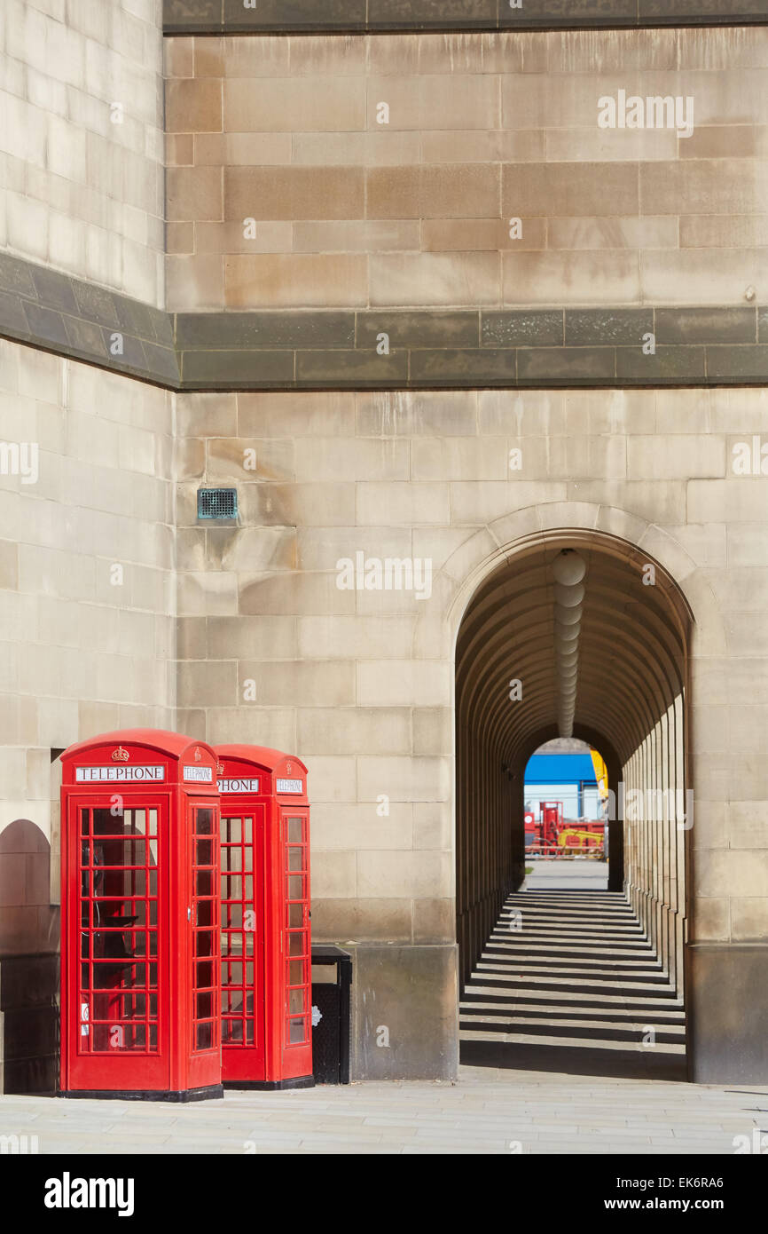 Manchester Town Hall extension arches walkway with red telephone boxes ...