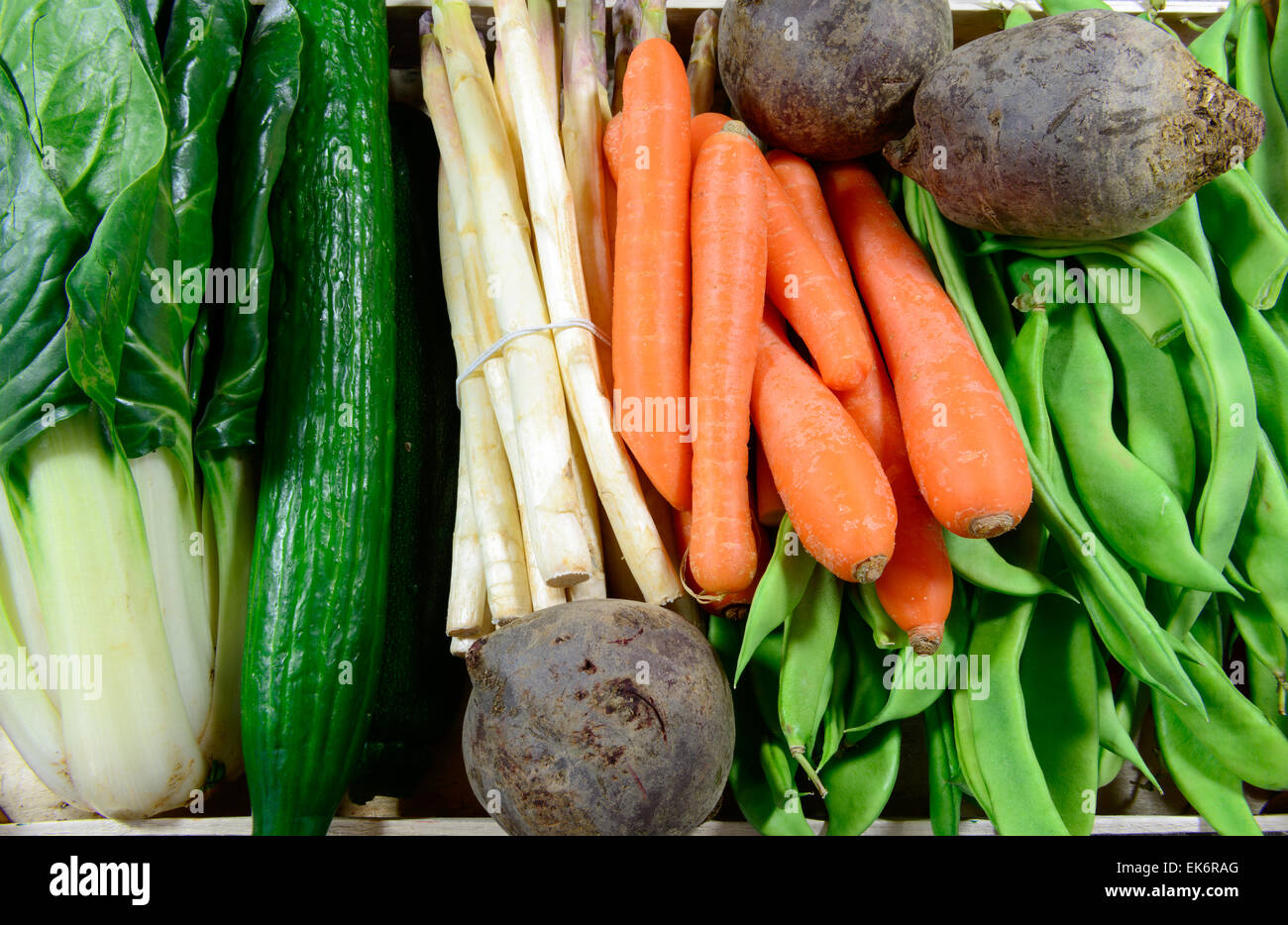 a small crate with various seasonal vegetables Stock Photo - Alamy