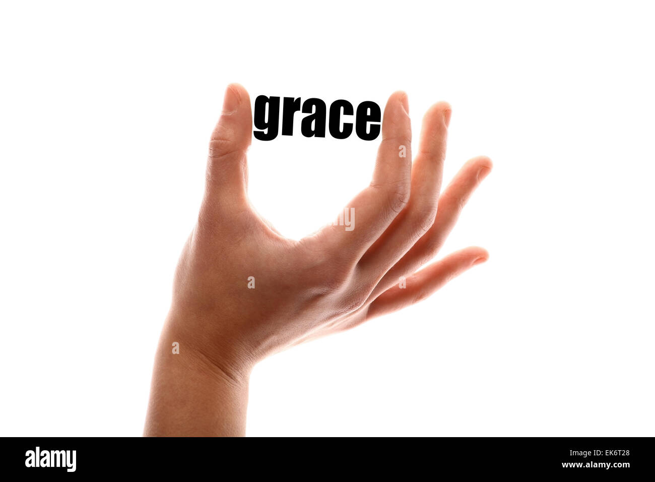 Color horizontal shot of a of a hand holding the word "grace Stock ...