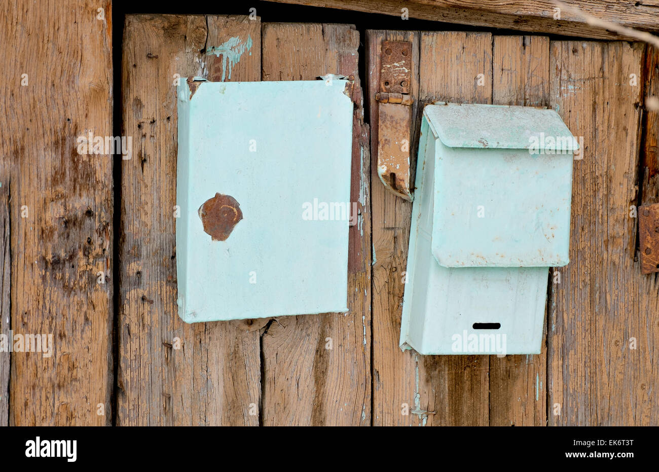 Old post boxes on the wooden wall of slum house in Astrakhan, Russia ...