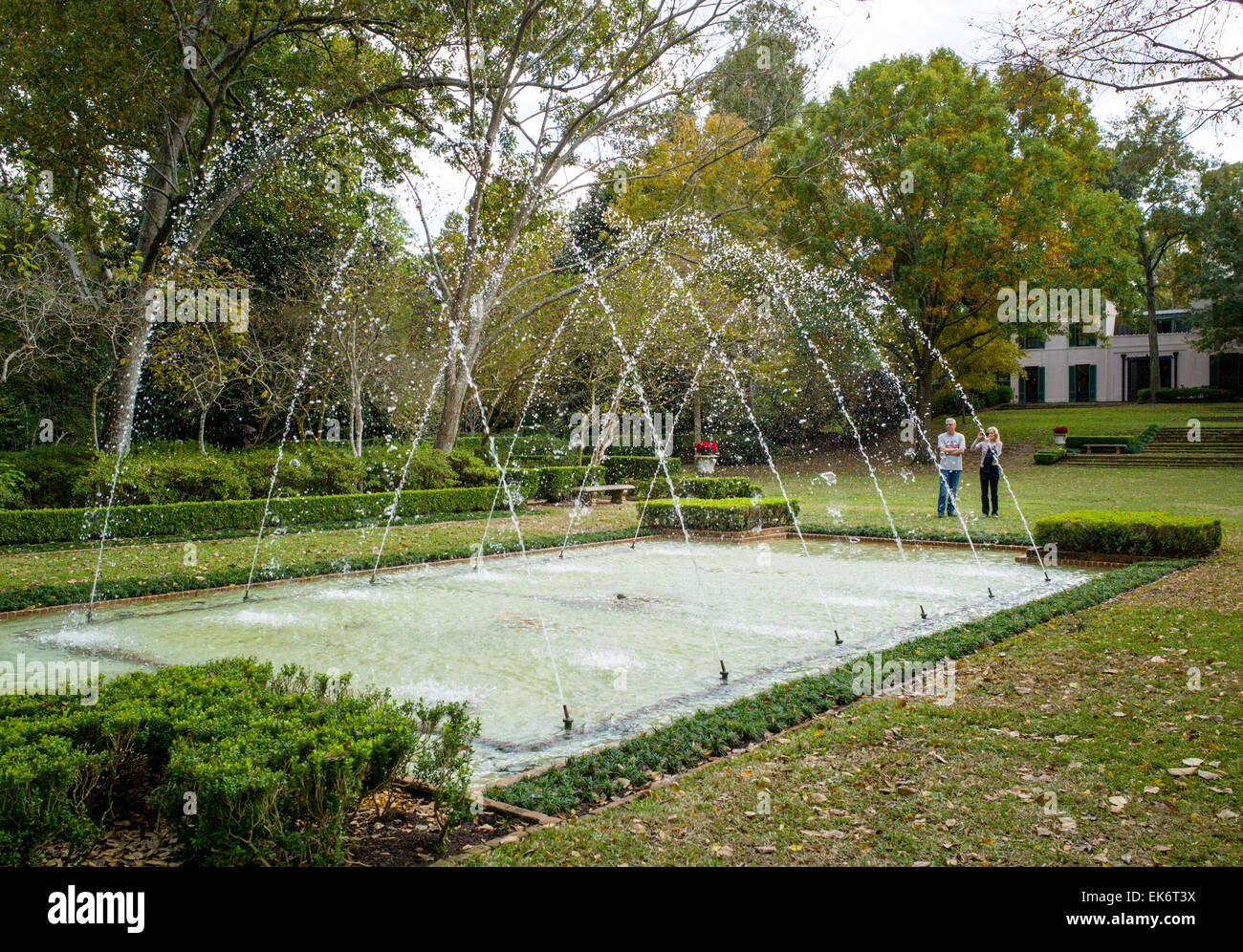 Tourists view fountains, Bayou Bend gardens & home, Museum of Fine Arts ...