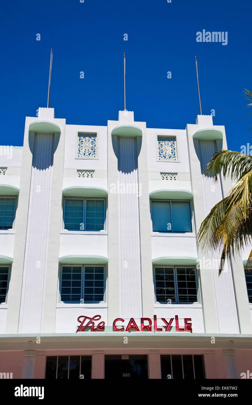 The famous art deco style Carlyle Hotel with palm tree against a deep ...