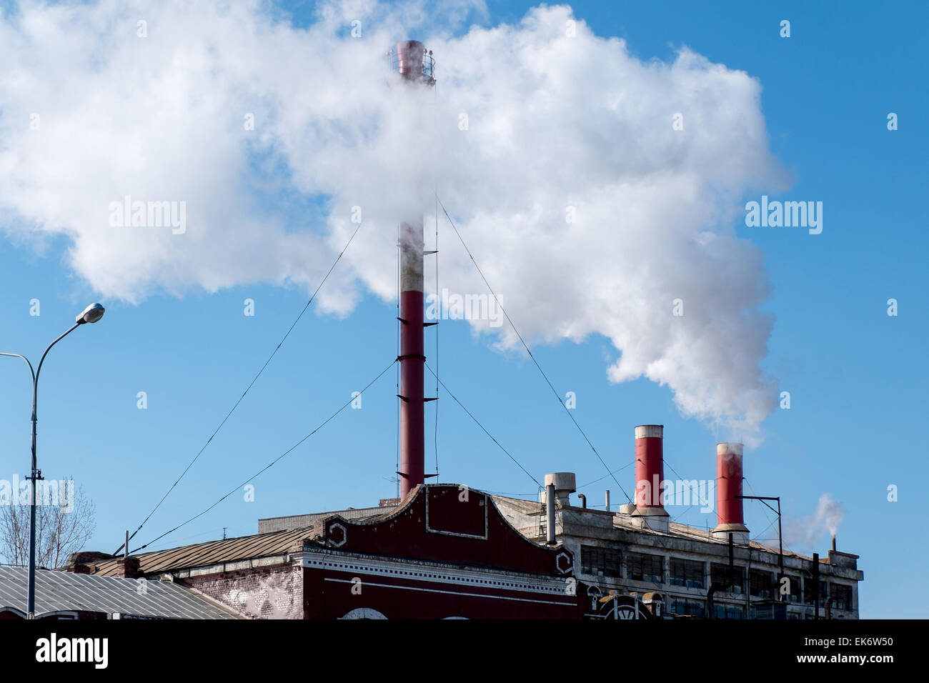 Pollution, smoke and steam discharged from an industrial facility Stock ...